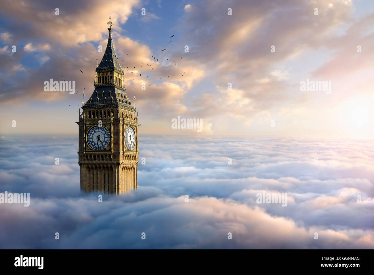 Birds flying around clock tower above clouds Stock Photo - Alamy