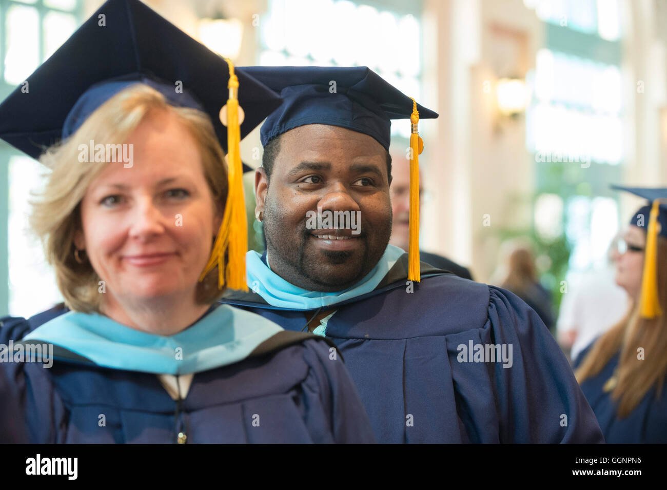 Graduation candidates in caps and gowns wait for Western Governors ...