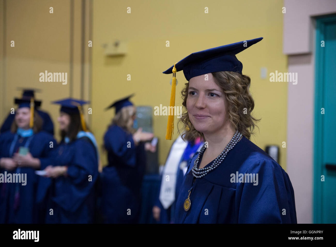 Graduation candidates in caps and gowns wait for Western Governors ...