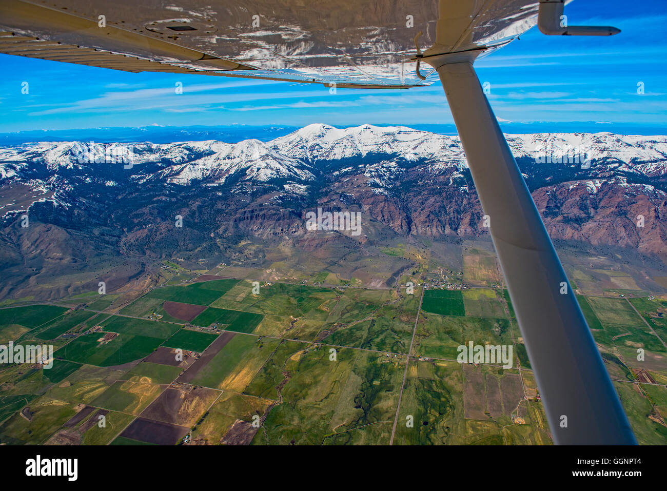 Aerial view of airplane wing over Cedarville, California, United States ...
