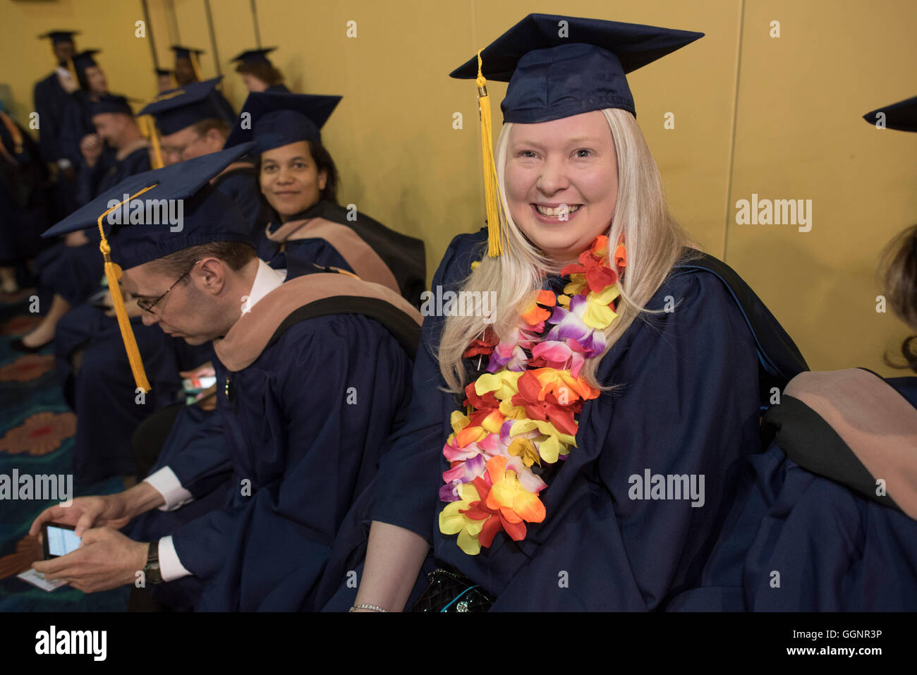 Graduation candidates in caps and gowns wait for Western Governors ...