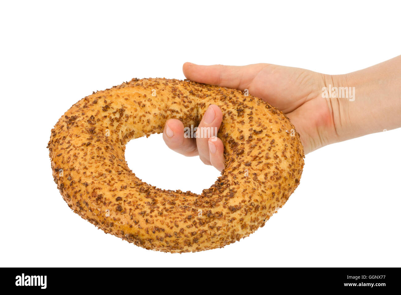 Female hand holding fresh bagel, isolated on white background Stock ...