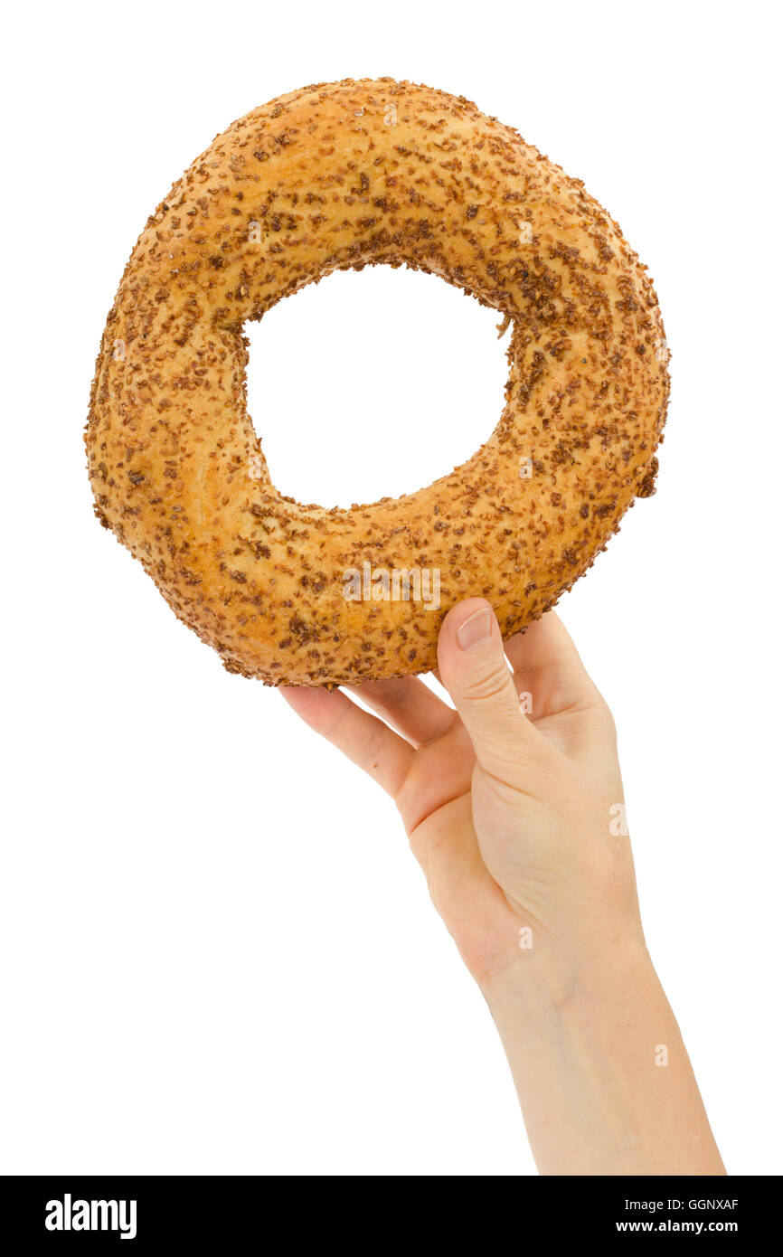 Female hand holding fresh bagel, isolated on white background Stock ...