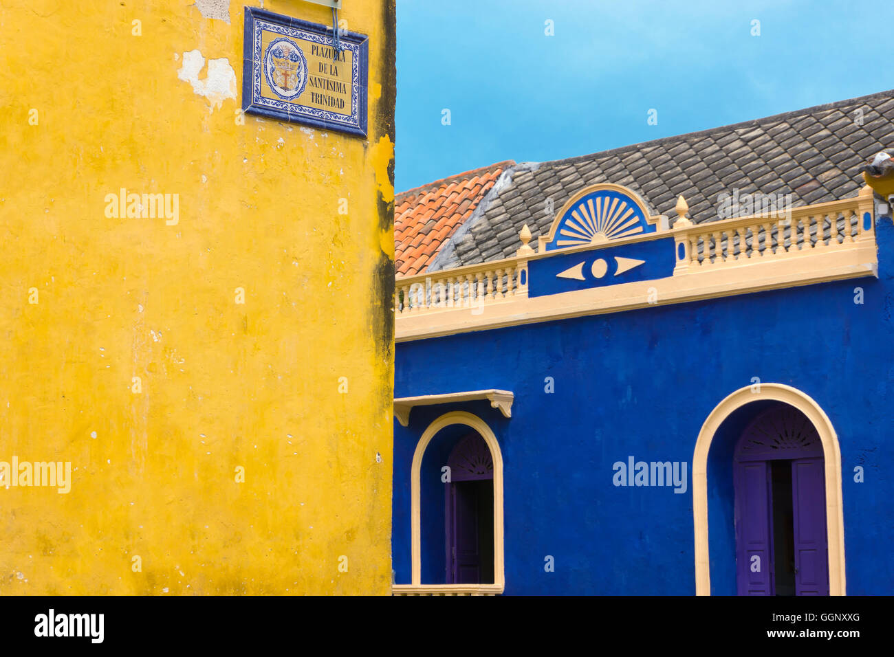 Historic yellow and blue colonial buildings and street signs Cartagena ...