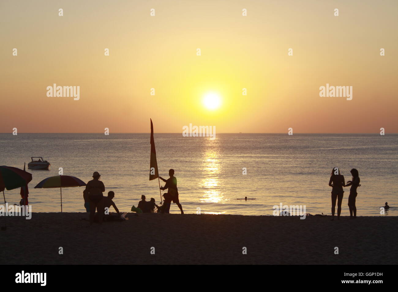 solitude, silhouette of people at sunset on the beach Stock Photo - Alamy