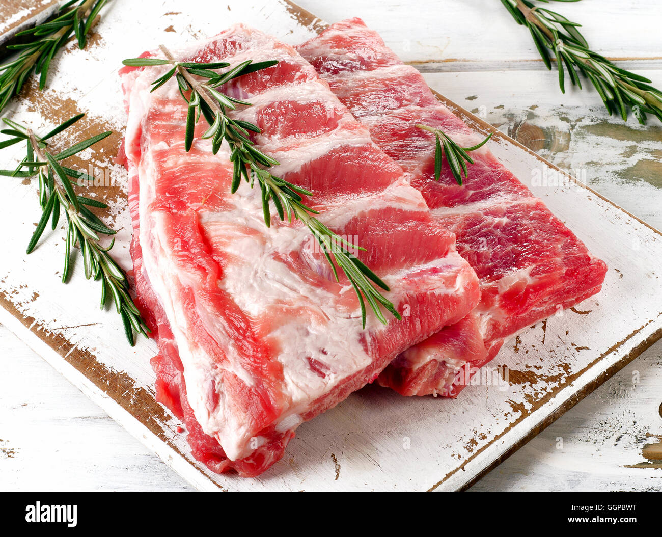 Raw spare ribs with fresh rosemary. Top view Stock Photo - Alamy