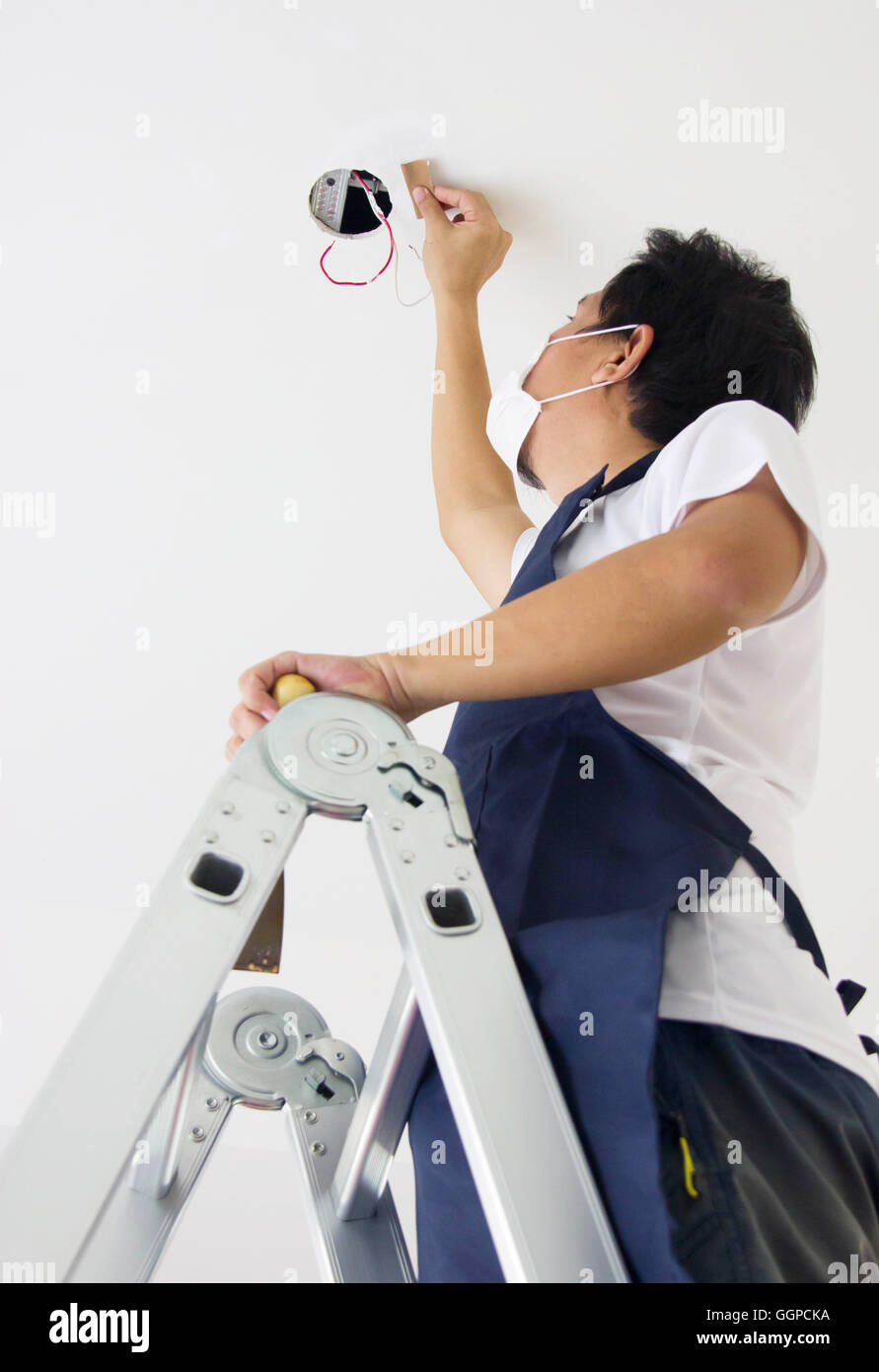 Fixing light fixture hi-res stock photography and images - Alamy