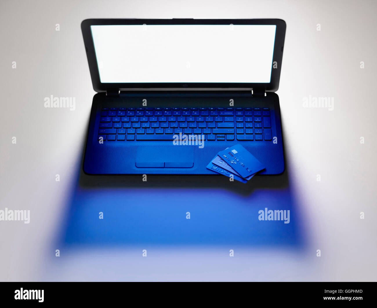 Credit cards on laptop computer Stock Photo - Alamy