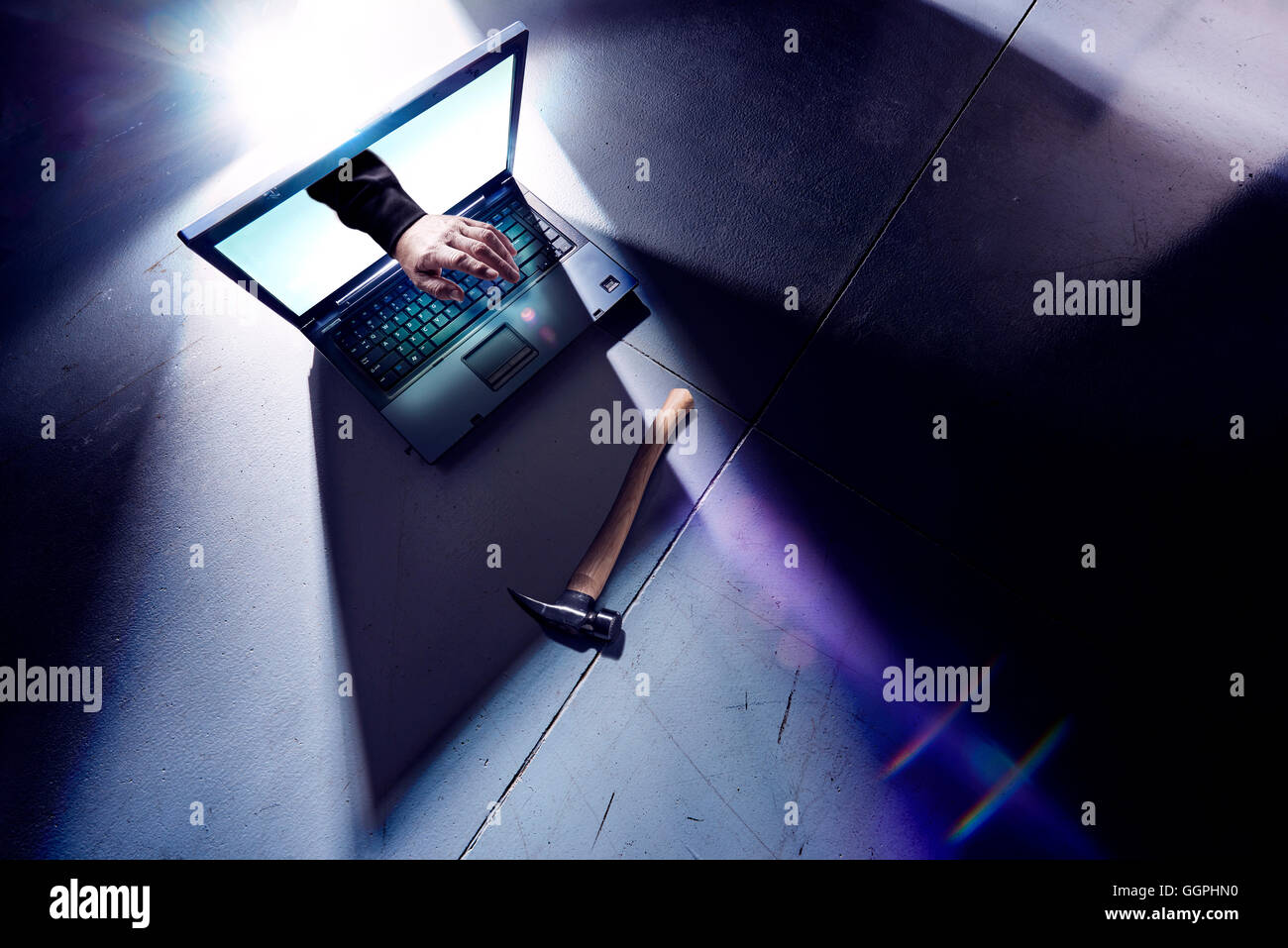 Hand of hacker reaching from screen of laptop and typing Stock Photo ...