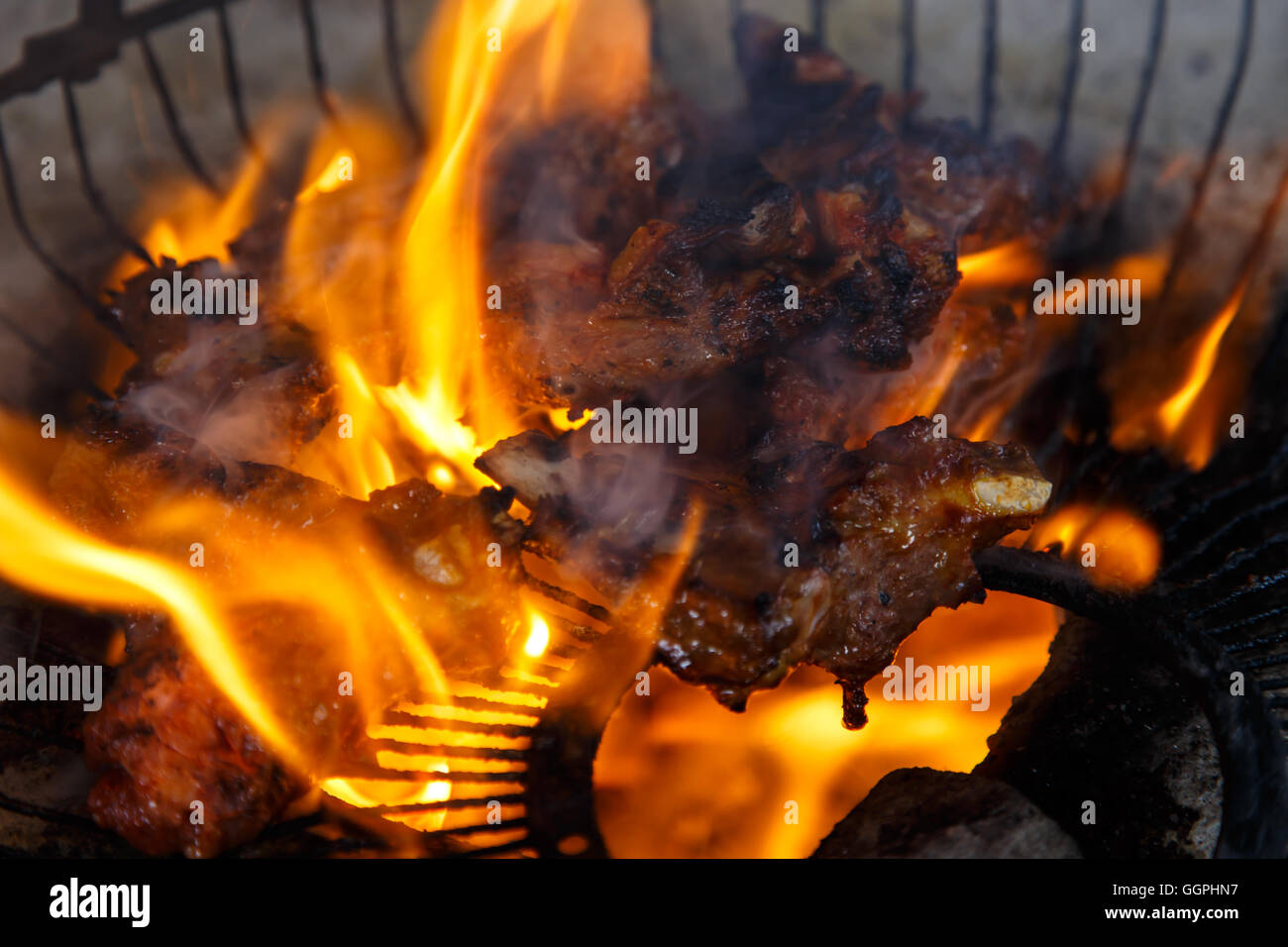 pork meat roasting on fire closeup Stock Photo - Alamy