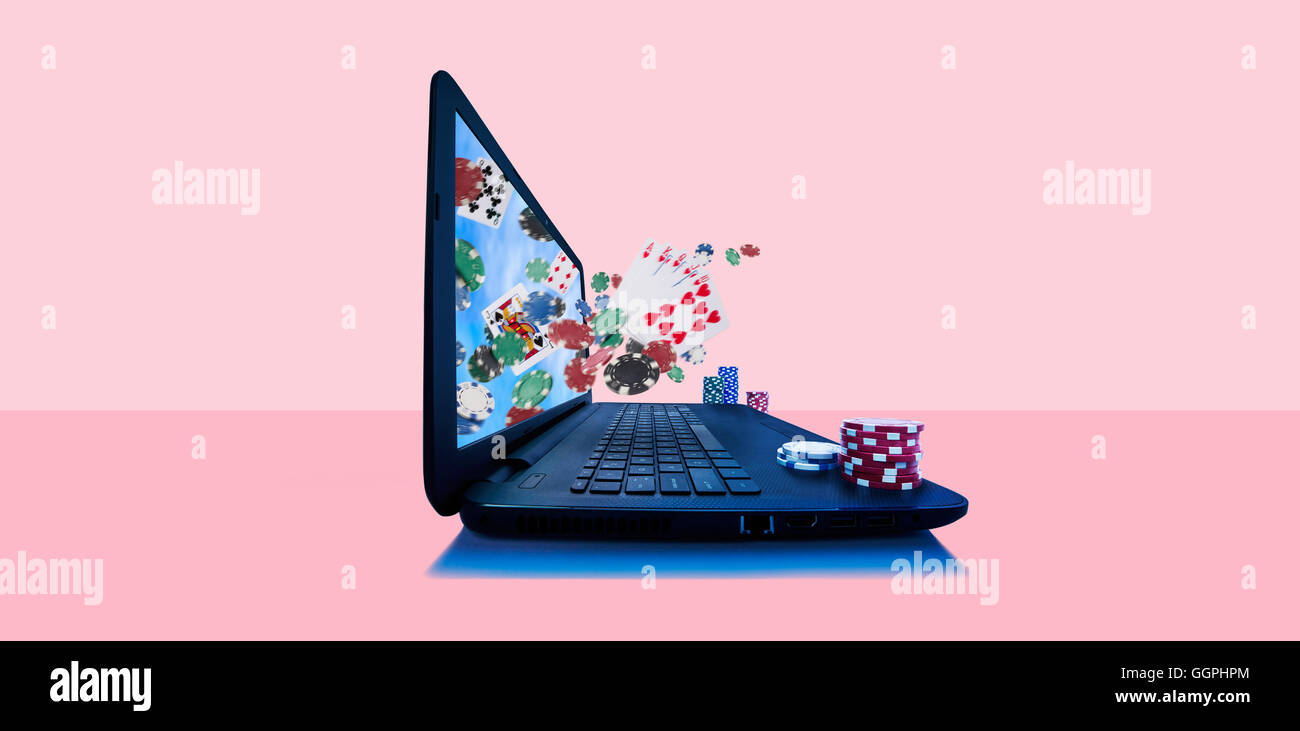 Playing cards and gambling chips emerging from laptop screen Stock ...