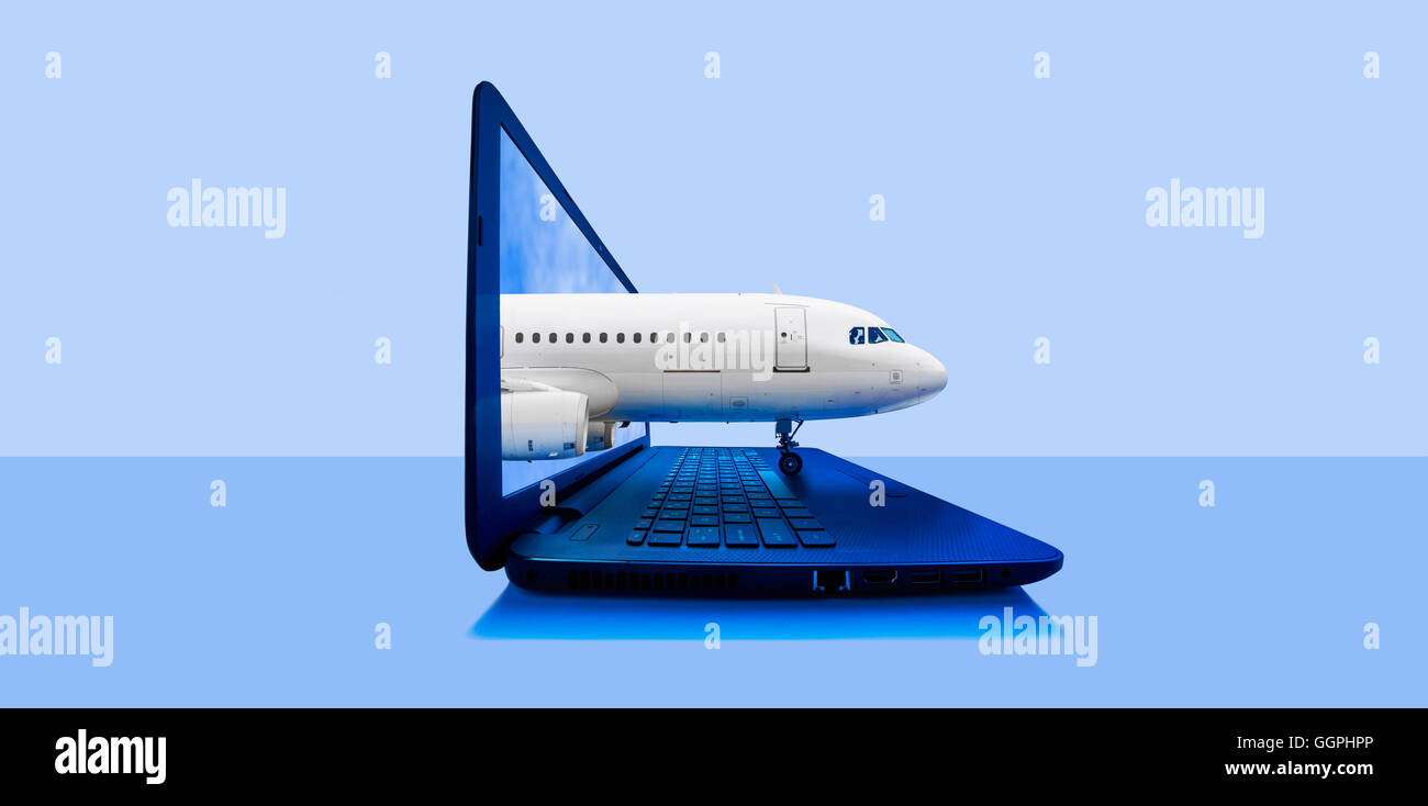 Airplane emerging from laptop screen Stock Photo - Alamy