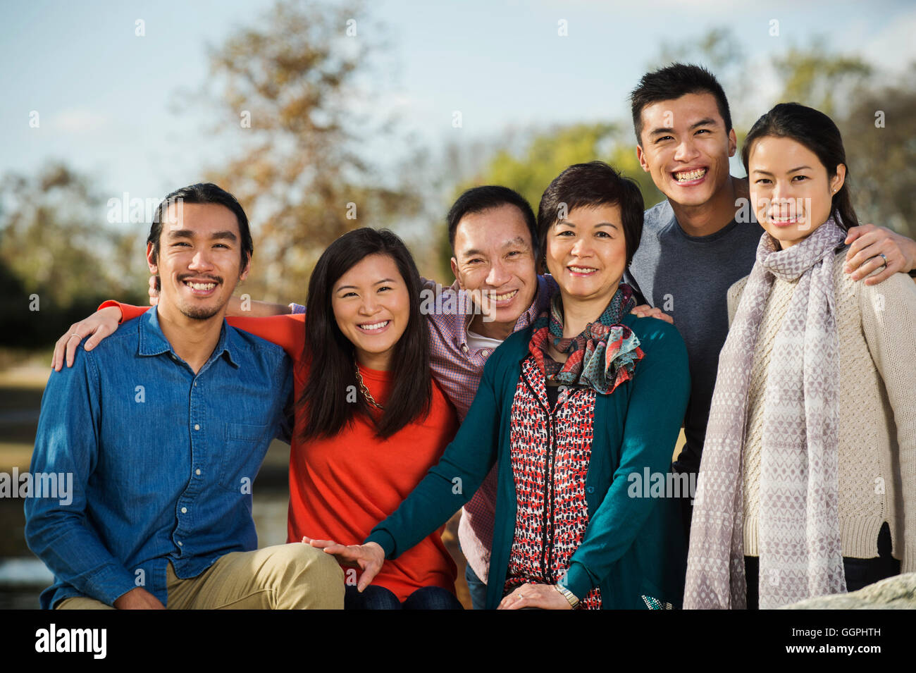 Chinese family smiling outdoors Stock Photo - Alamy