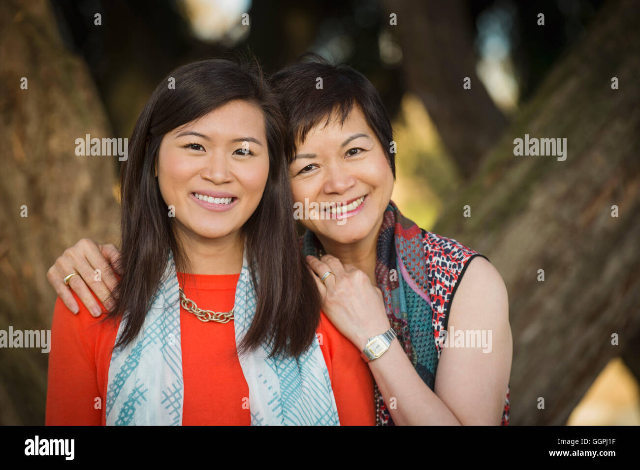Chinese mother and daughter hugging outdoors Stock Photo - Alamy