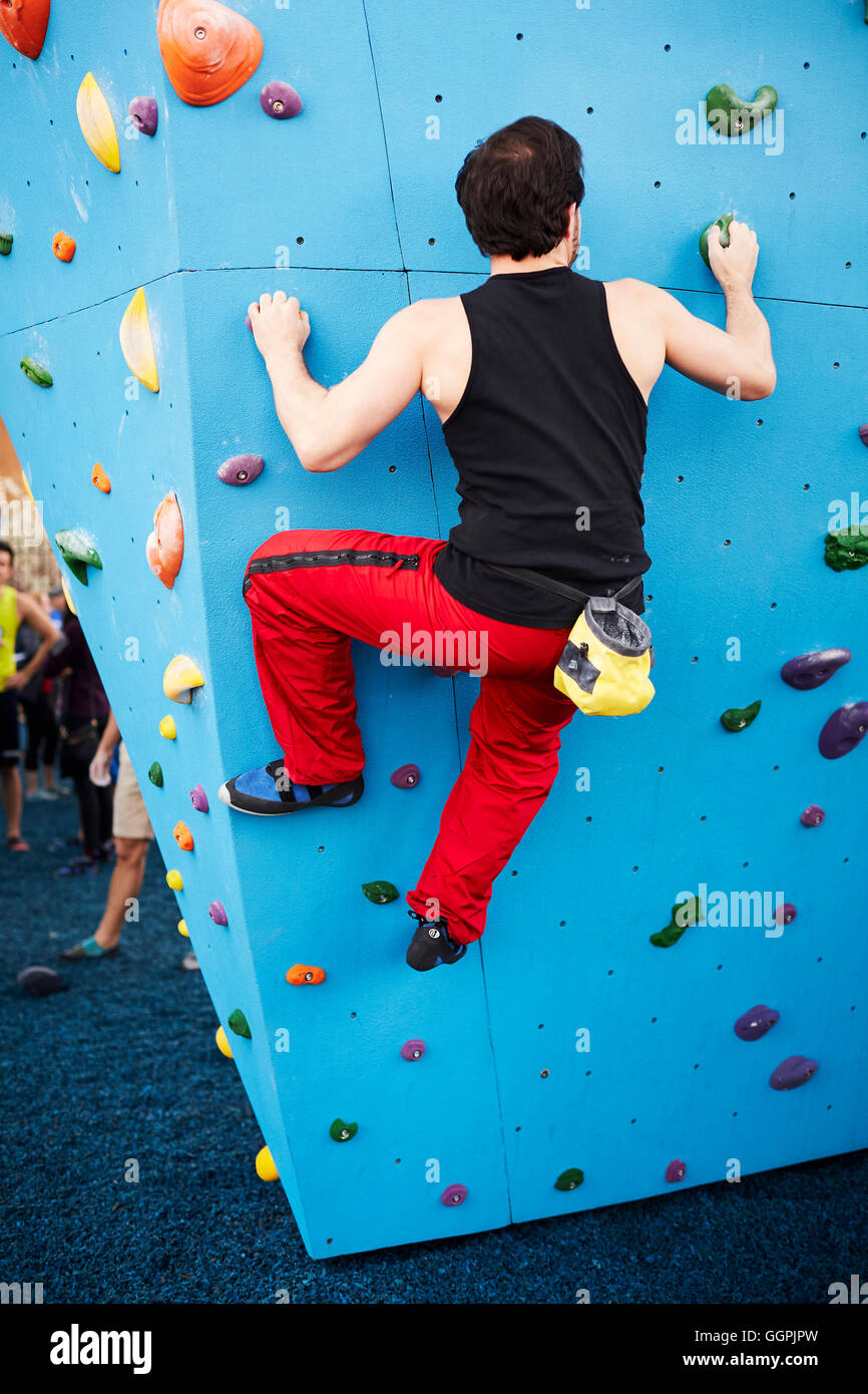 Caucasian man climbing outdoor climbing wall Stock Photo - Alamy