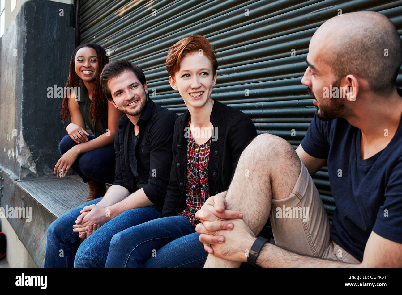 Group listening at the door hi-res stock photography and images - Alamy