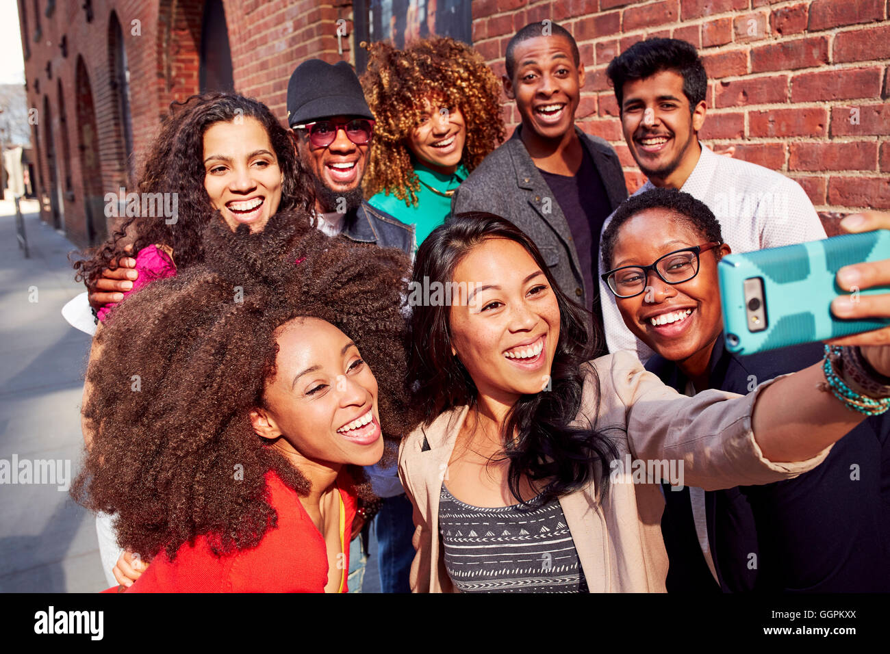 Friends talking selfie on city sidewalk Stock Photo - Alamy