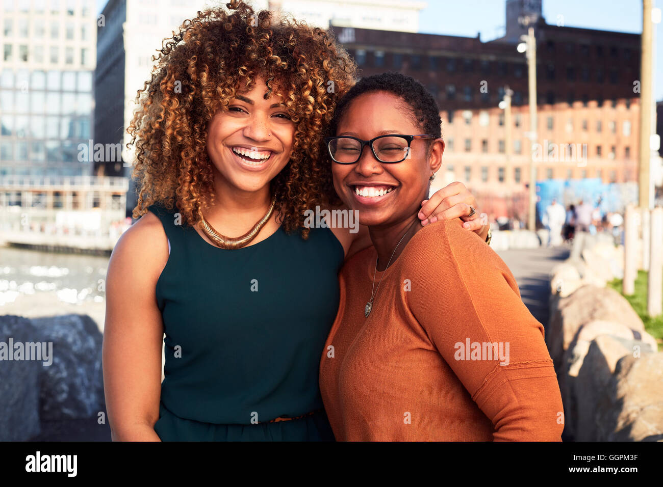 Black women smiling waterfront hi-res stock photography and images - Alamy