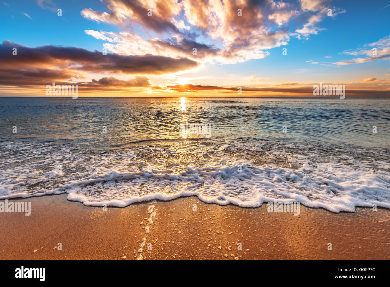 Colorful ocean beach sunrise Stock Photo - Alamy