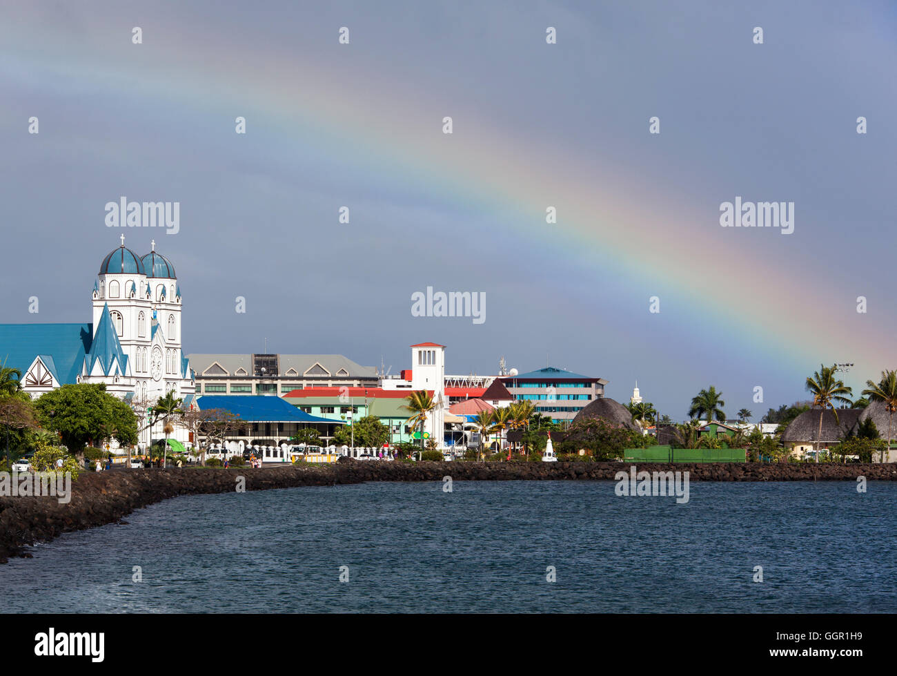The view of a morning rainbow over Apia town on Upolu island (Samoa ...