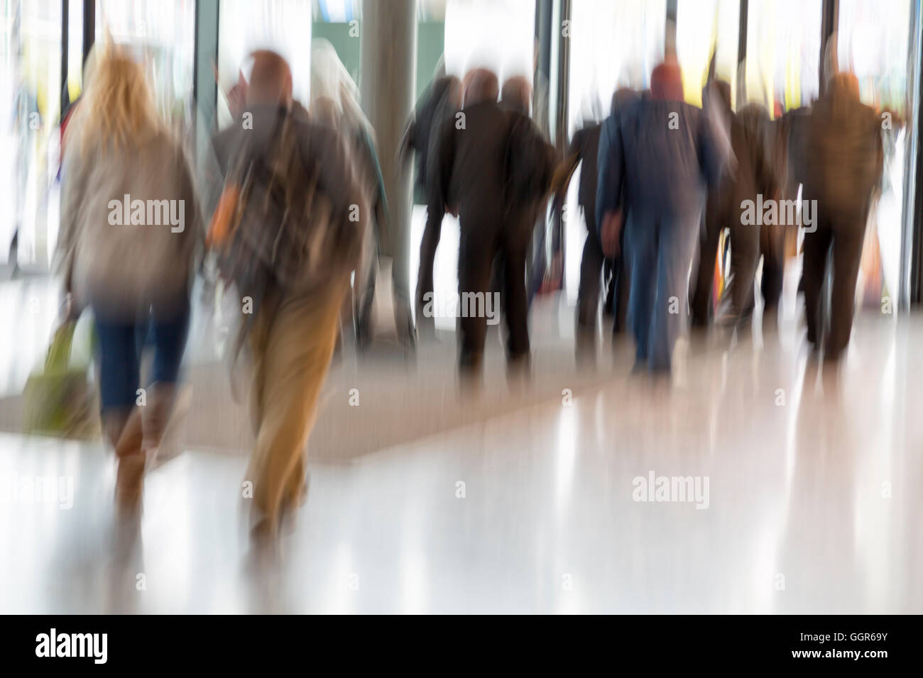 People stream in modern interior, motion blur Stock Photo - Alamy