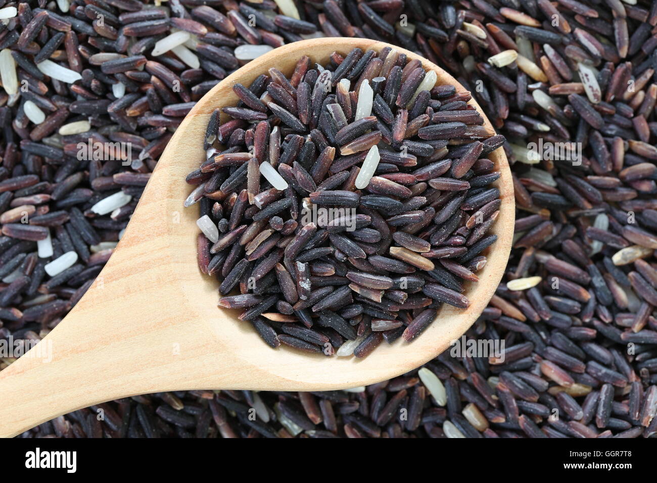Organic riceberry in wooden spoon for the nature food background,grain ...
