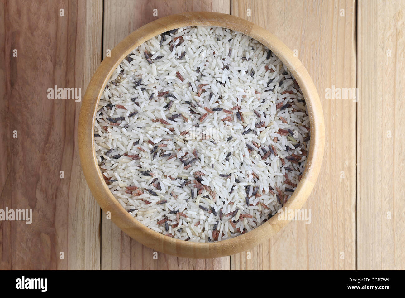 Organic rice in wooden bowl on wood background concept for nature food ...