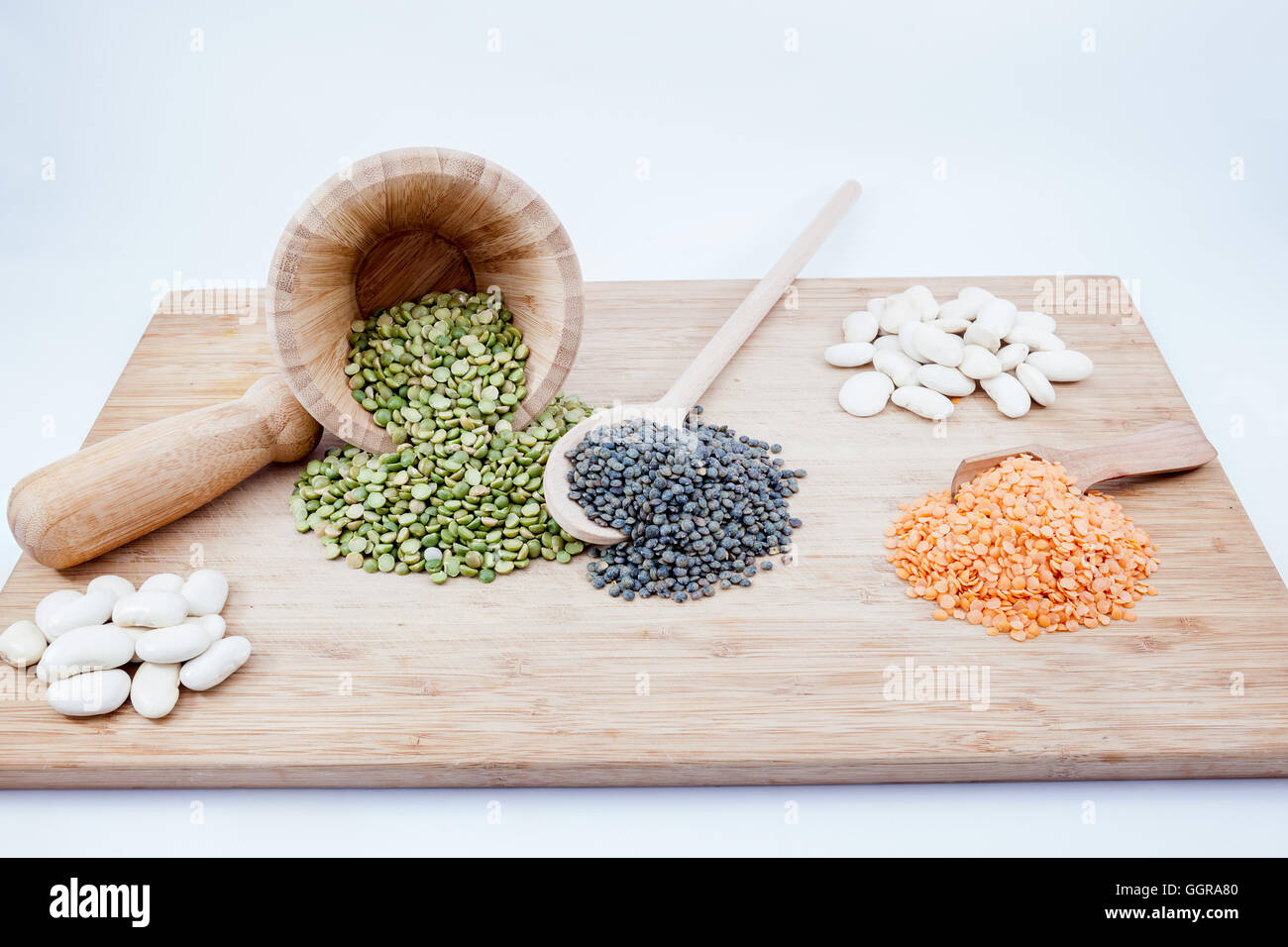 on an wooden board there are three kinds of seeds Stock Photo - Alamy