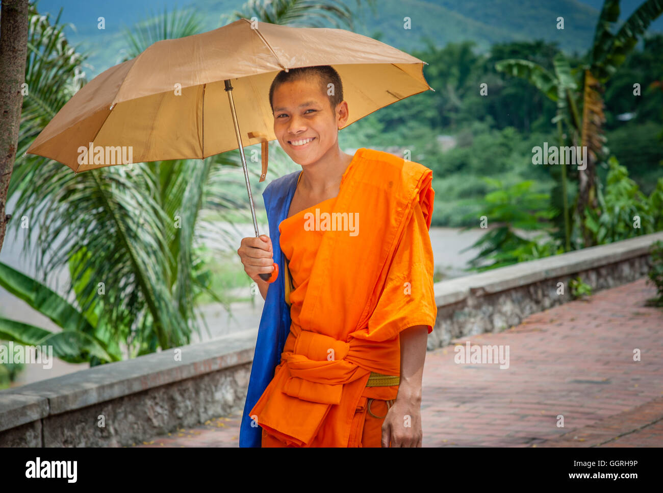 Monk with umbrella hi-res stock photography and images - Alamy
