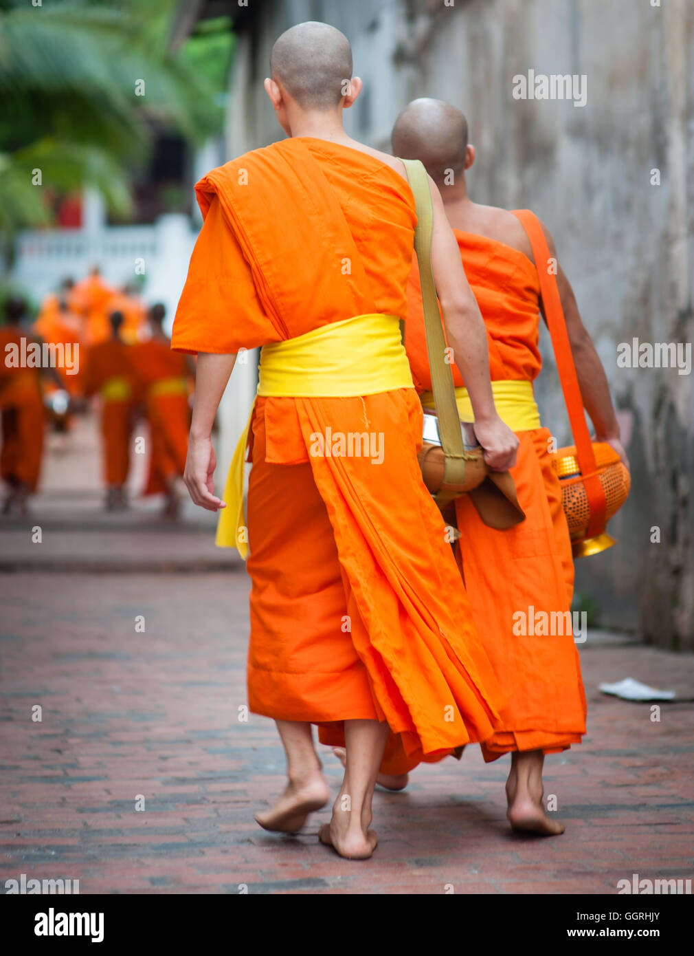 Buddhist monks in orange robes hi-res stock photography and images - Alamy