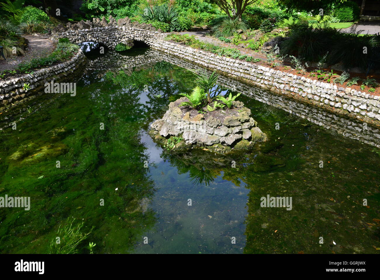 A Rock built bridge in an English country garden in Surrey Stock Photo ...