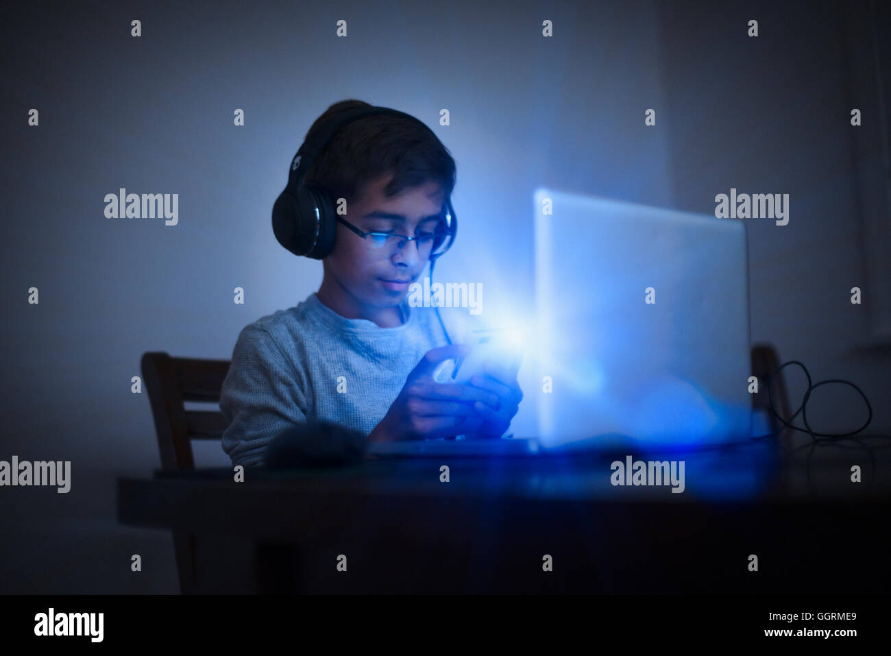 Indian boy using technology hi-res stock photography and images - Alamy
