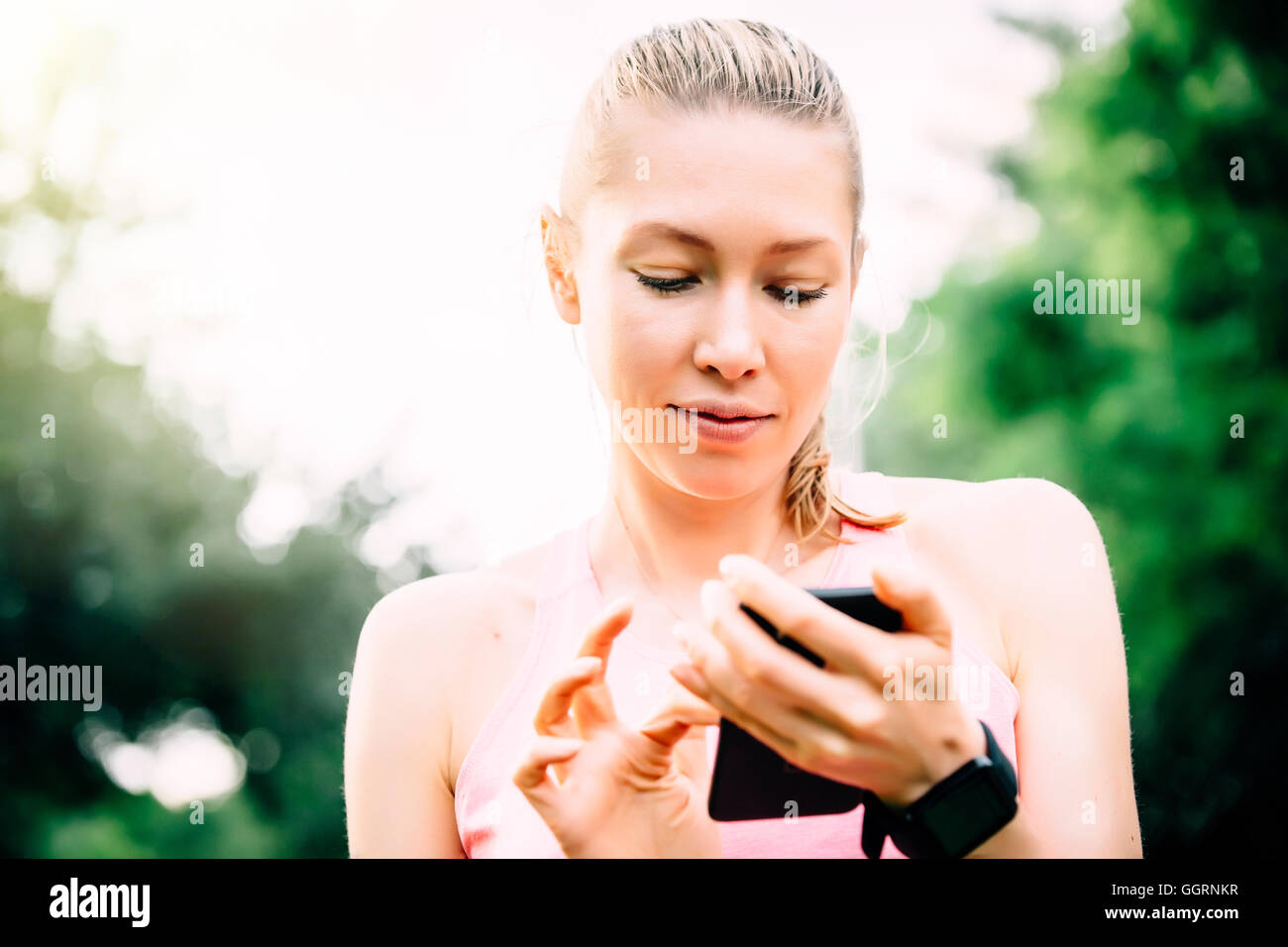 Caucasian woman using cell phone outdoors Stock Photo - Alamy