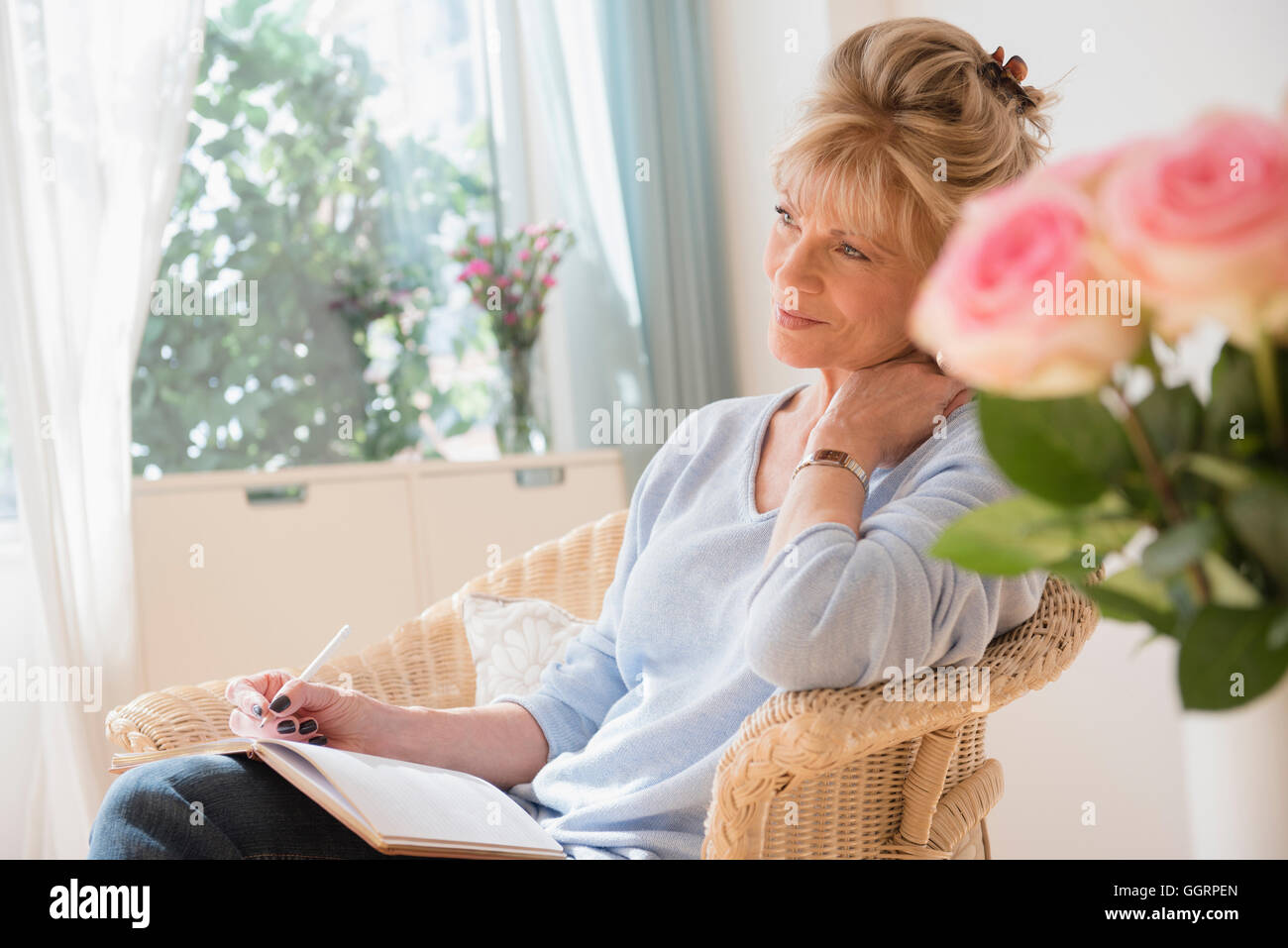 Older person writing in journal hi-res stock photography and images - Alamy