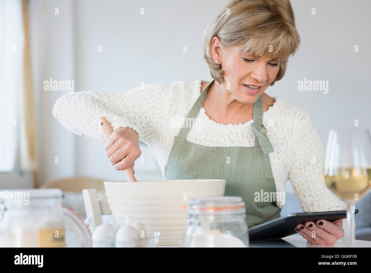 Older Caucasian woman reading recipe on digital tablet Stock Photo - Alamy