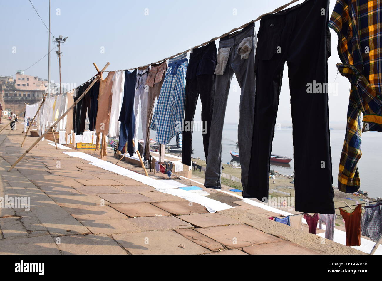 Trousers drying beside river Ganga on the ghats of Varanasi, Uttar ...