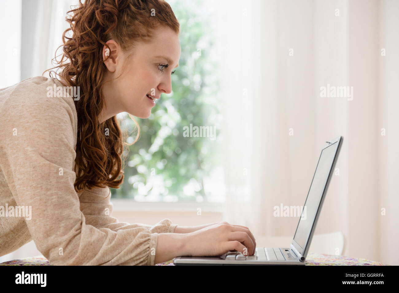 Woman working laptop concentrating hi-res stock photography and images ...