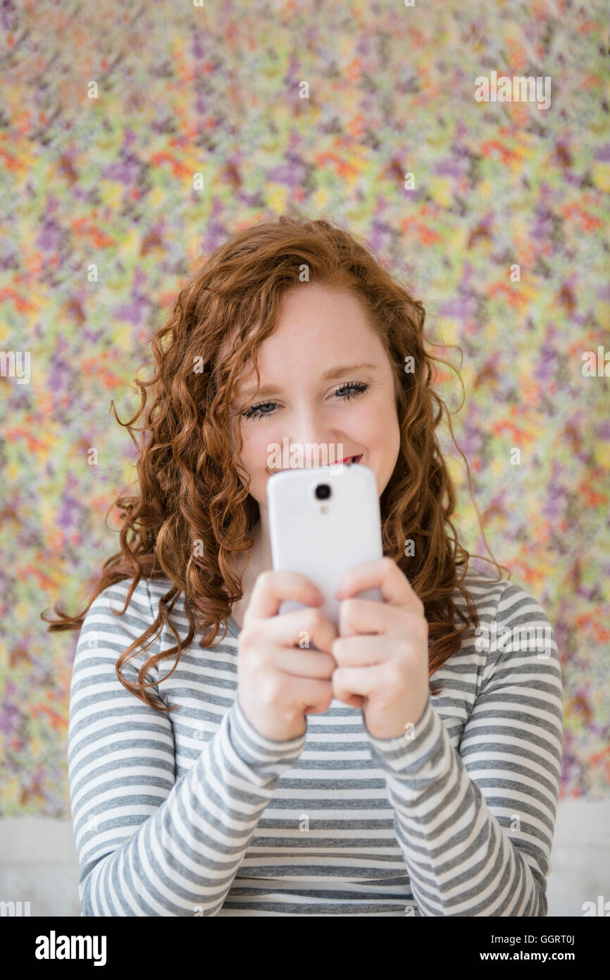 Caucasian woman taking cell phone selfie Stock Photo - Alamy