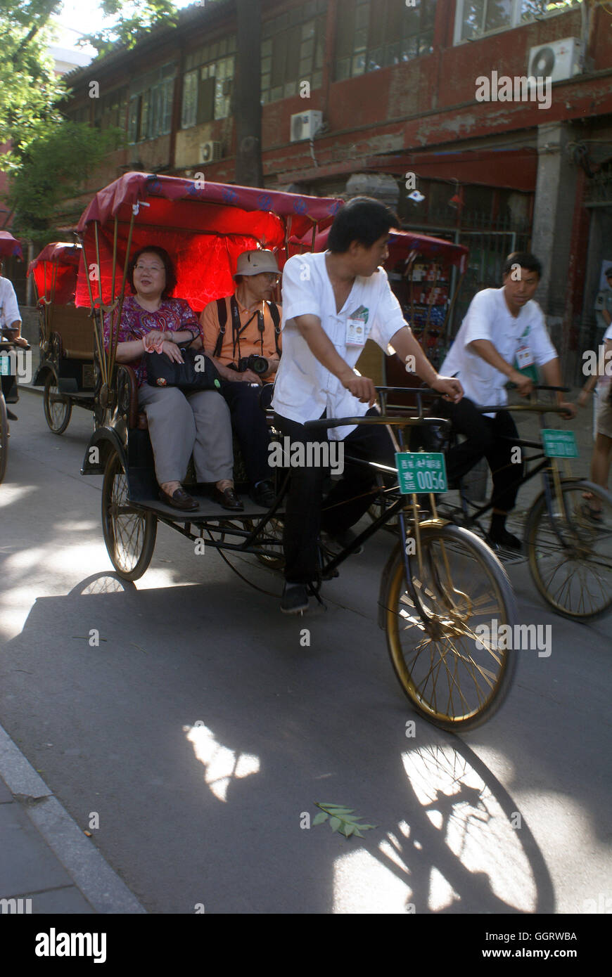 Bicycle rickshaws are a common sight in the back lake district hutong ...