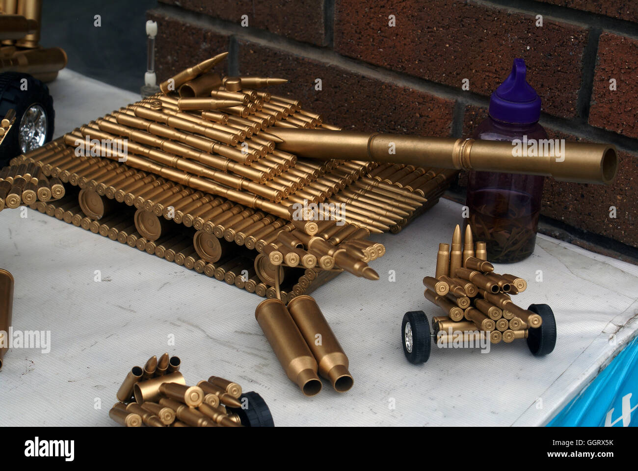 Toy tanks and howitzers made from shell casings at a souvenir kiosk ...