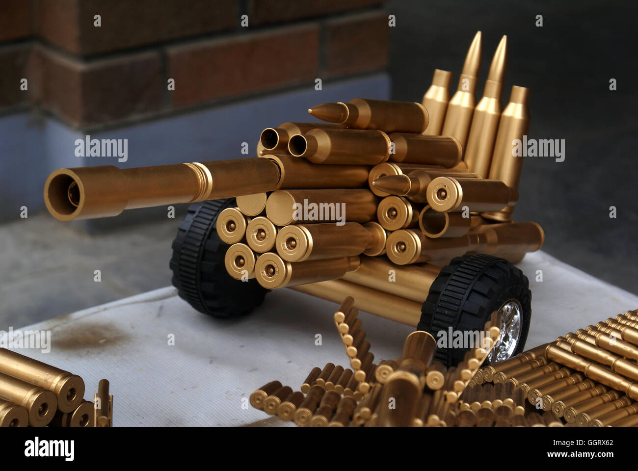 Toy tanks and howitzers made from shell casings at a souvenir kiosk ...
