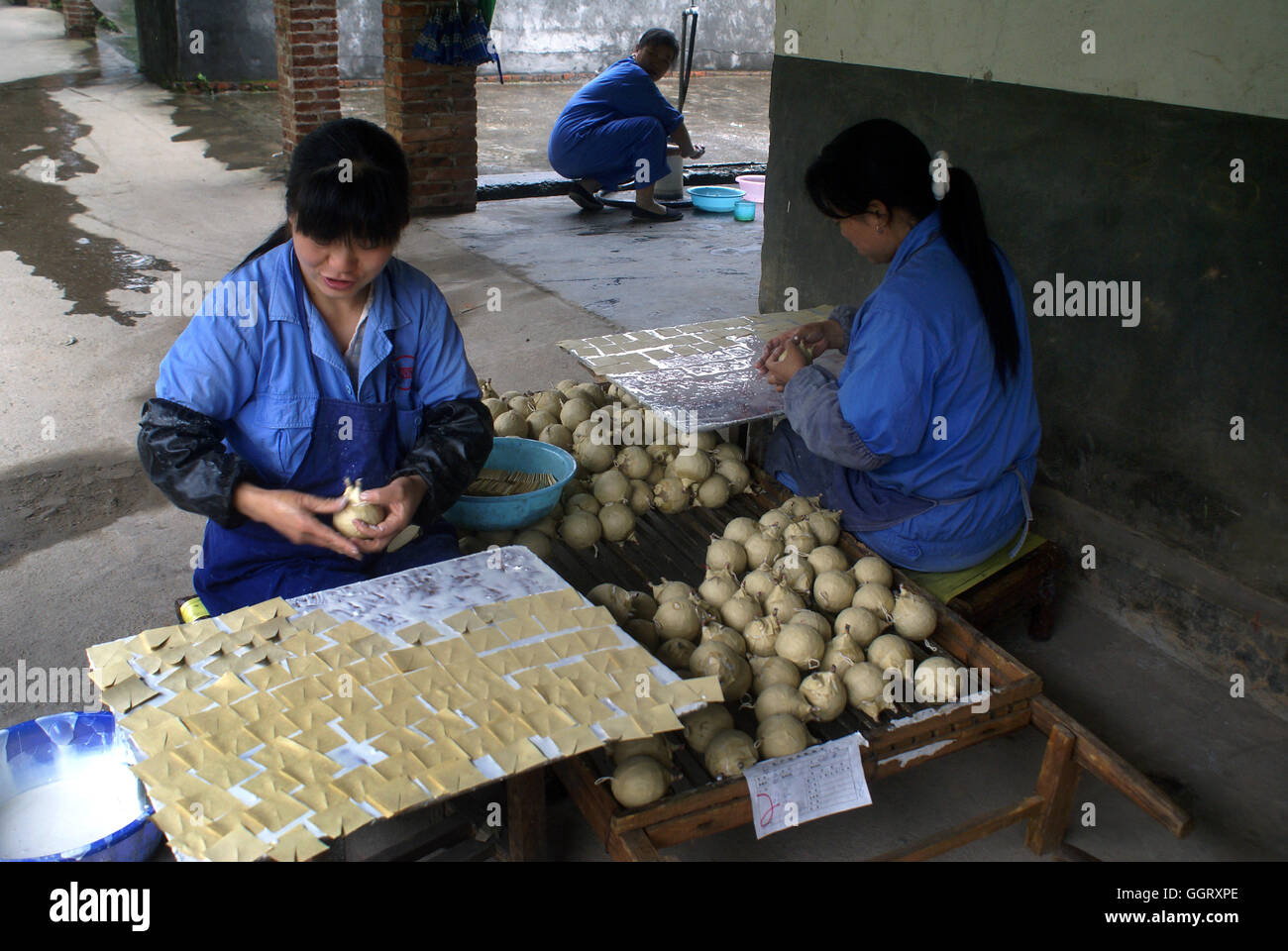 Workers assembling three inch shells at the Sunny International ...