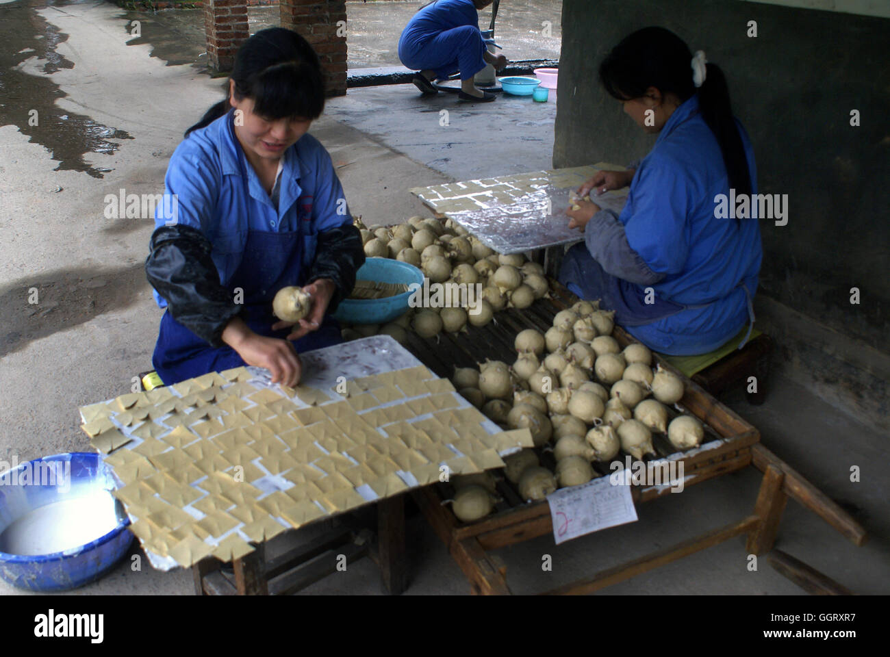 Workers assembling three inch shells at the Sunny International ...