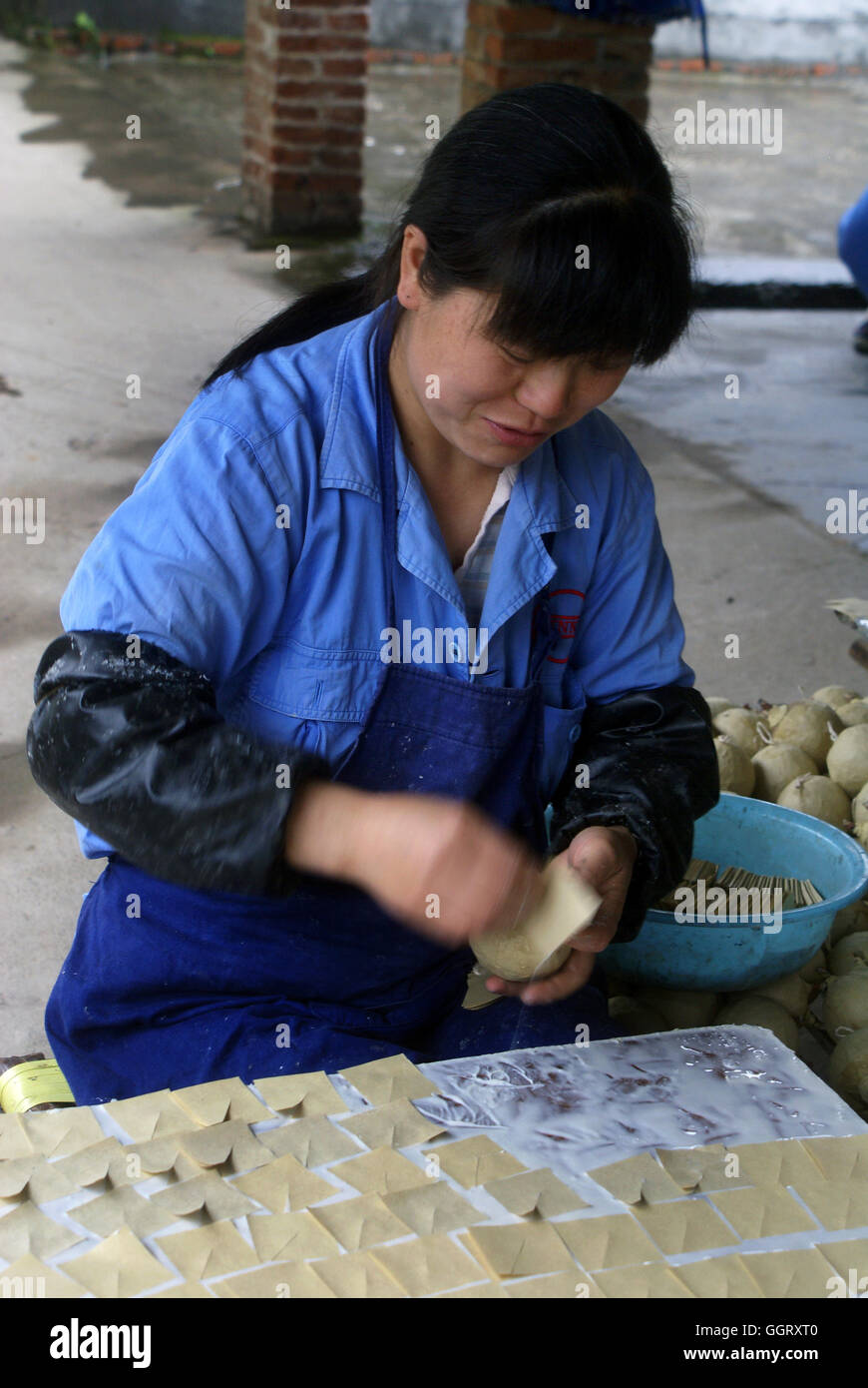 Workers assembling three inch shells at the Sunny International ...