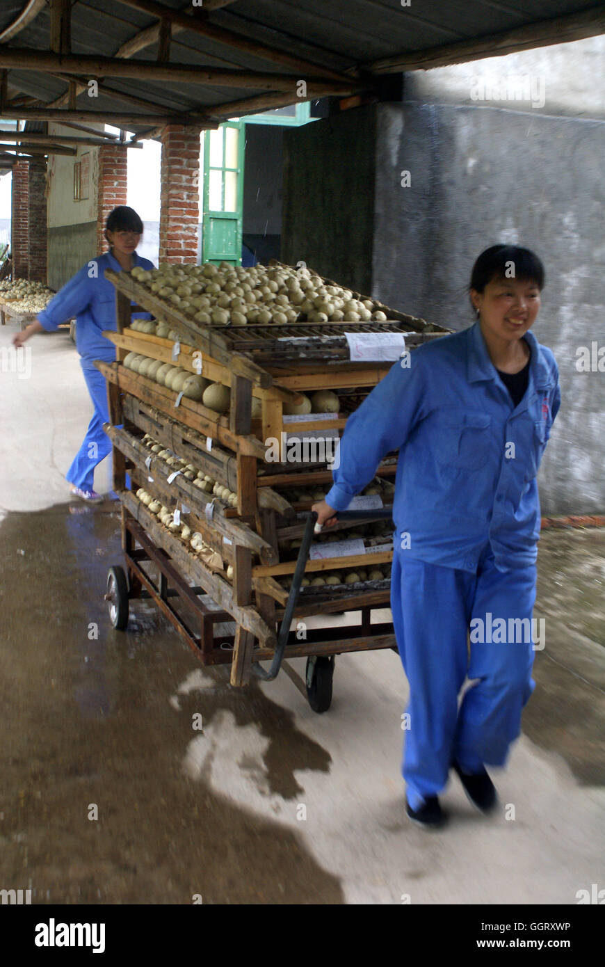 Workers assembling three inch shells at the Sunny International ...