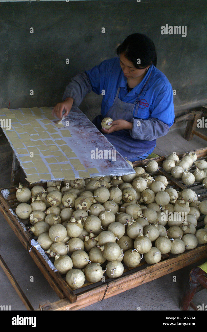 Workers assembling three inch shells at the Sunny International ...