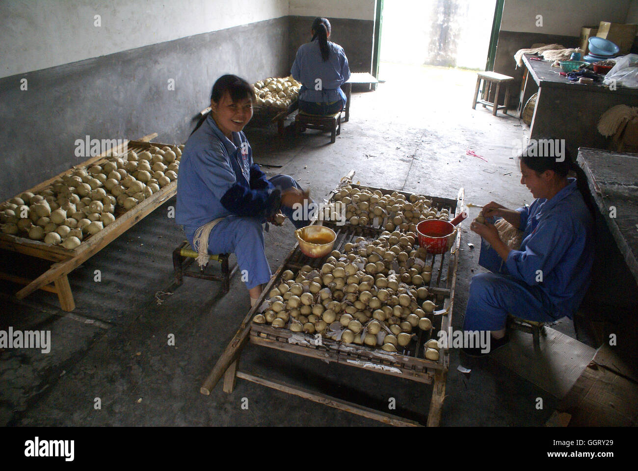 Workers assembling three inch shells at the Sunny International ...