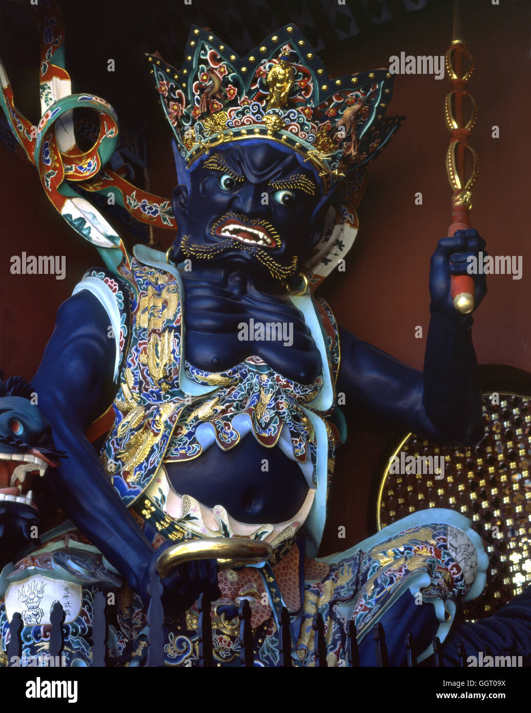 A ferocious god at the entrance to the Huatang Temple near Kunming, the ...