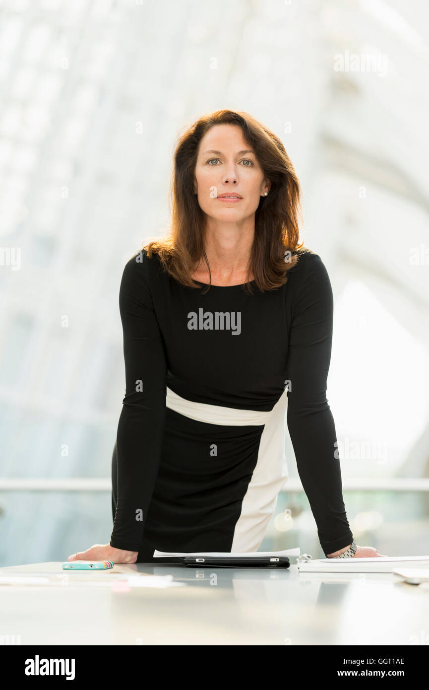 Leaning on table hi-res stock photography and images - Alamy