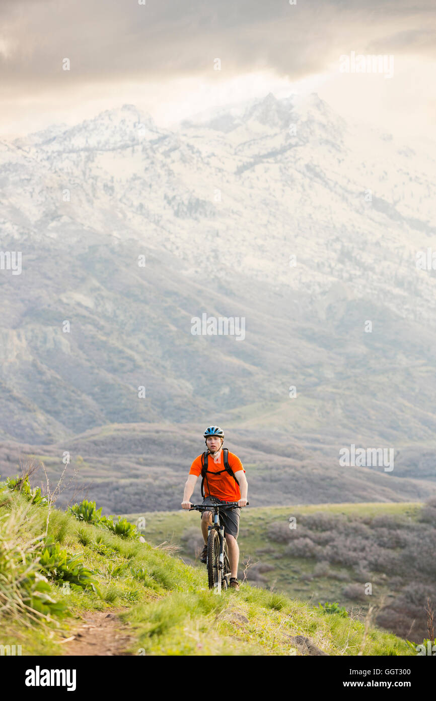 Man riding bike away hi-res stock photography and images - Alamy